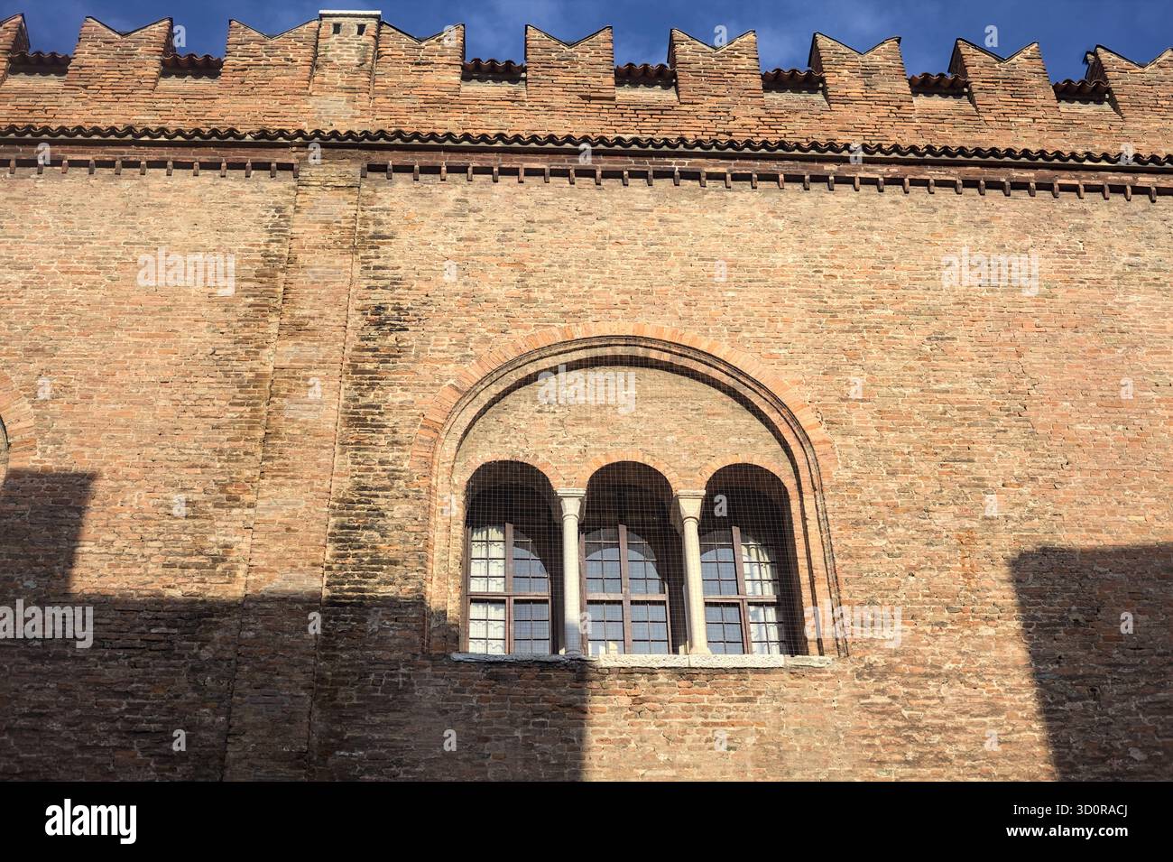Section of the facade of a palace with arched windows and the sky in ...