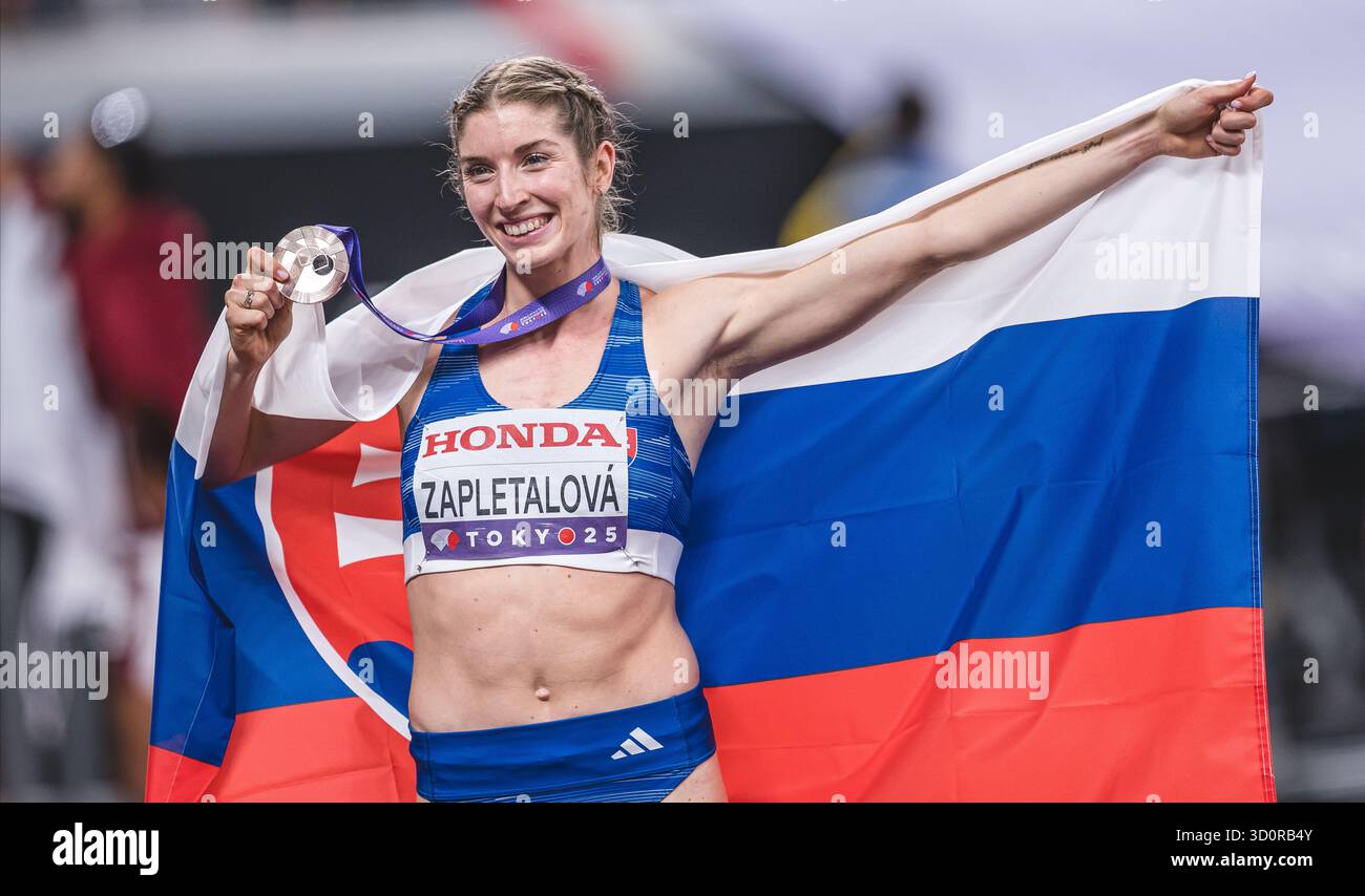 Emma Zapletalová celebrating her medal with her country's flag at the ...