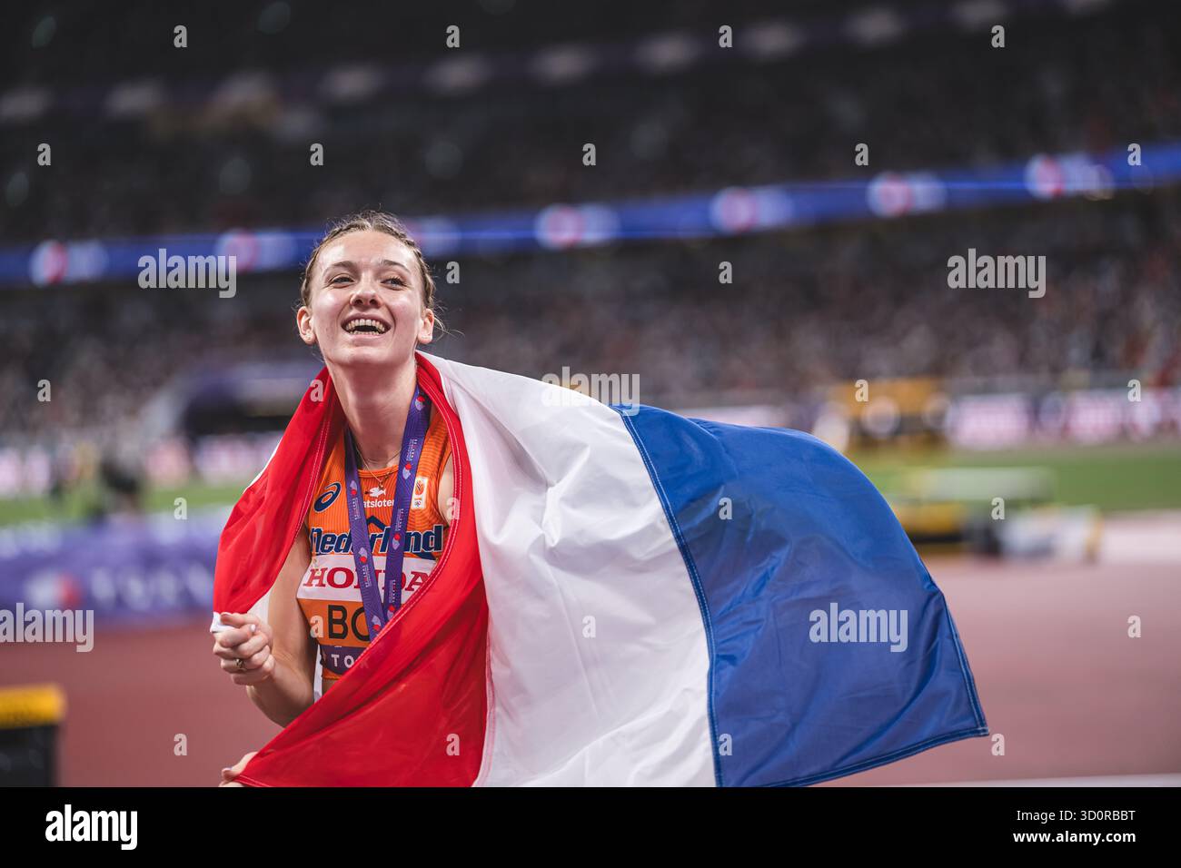 Femke Bol celebrating her medal with her country's flag at the 2025 ...