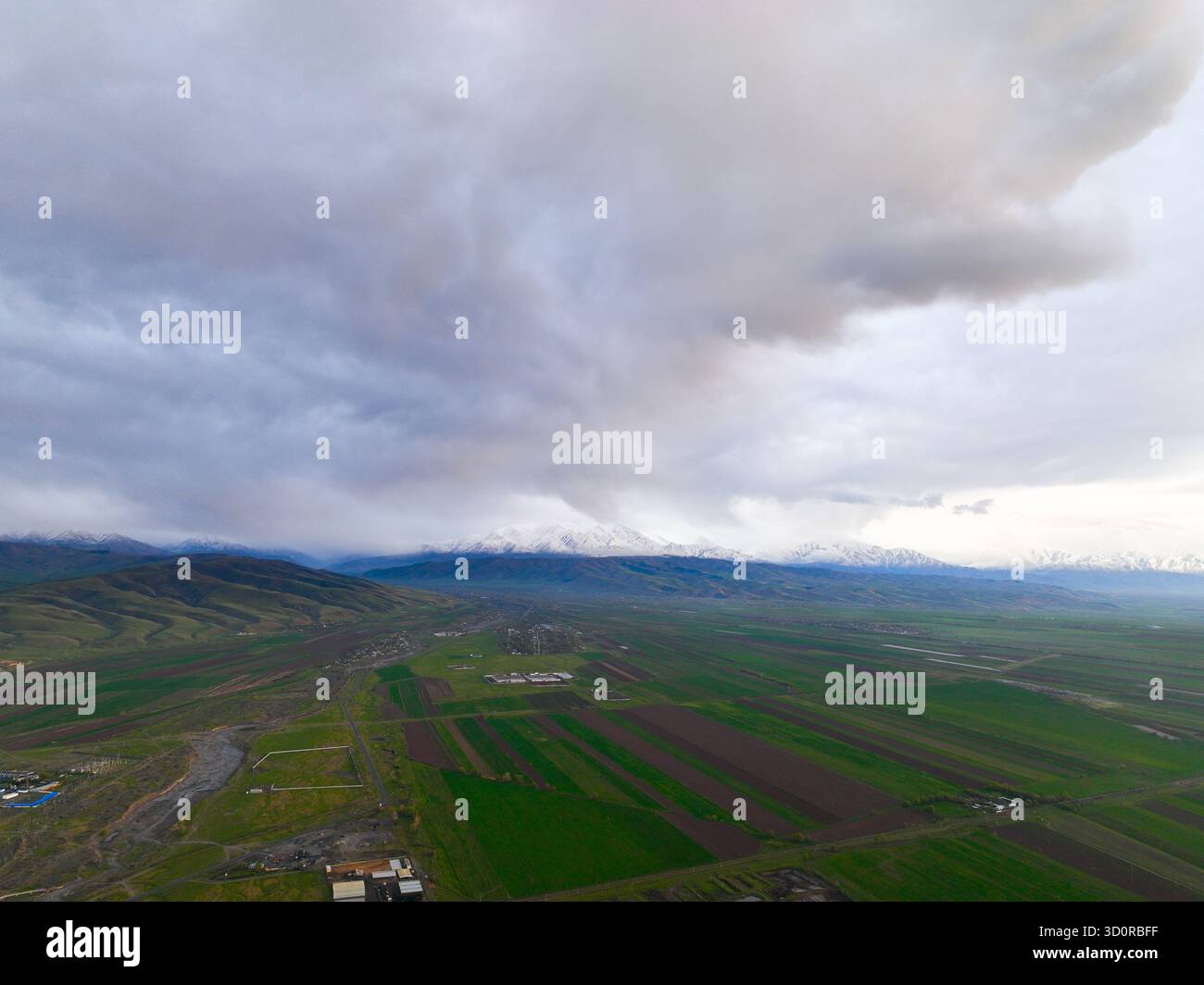 Wide aerial panorama of vast green agricultural fields and rolling ...