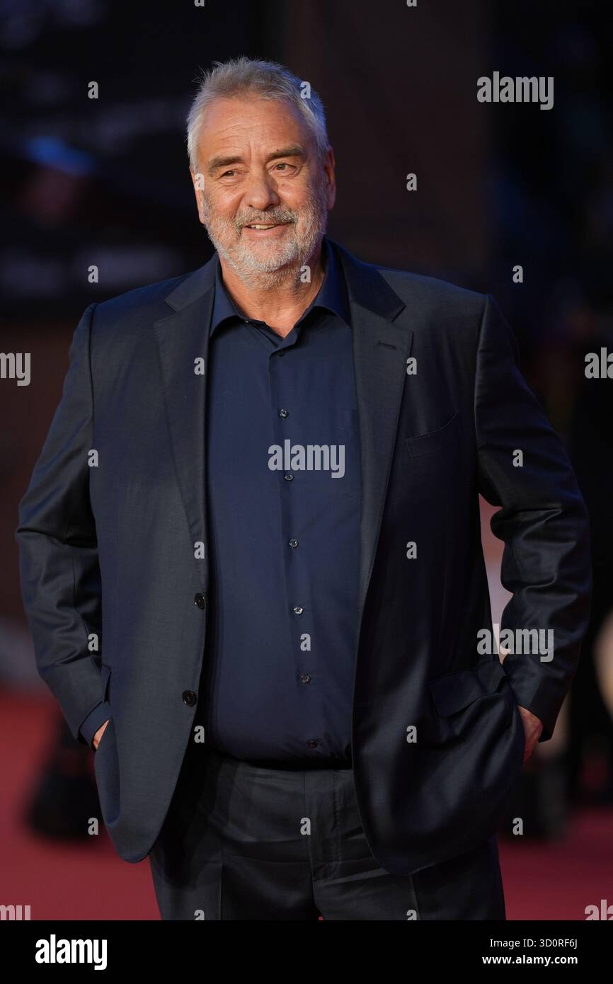 Luc Besson poses for photos on the red carpet for the screening of the ...