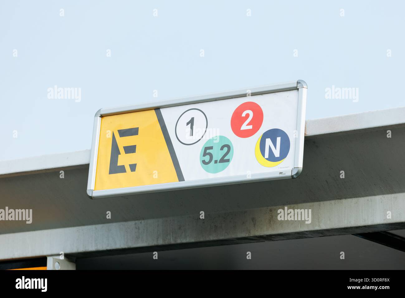 Modern parking garage sign with color-coded numbers and symbols Stock ...