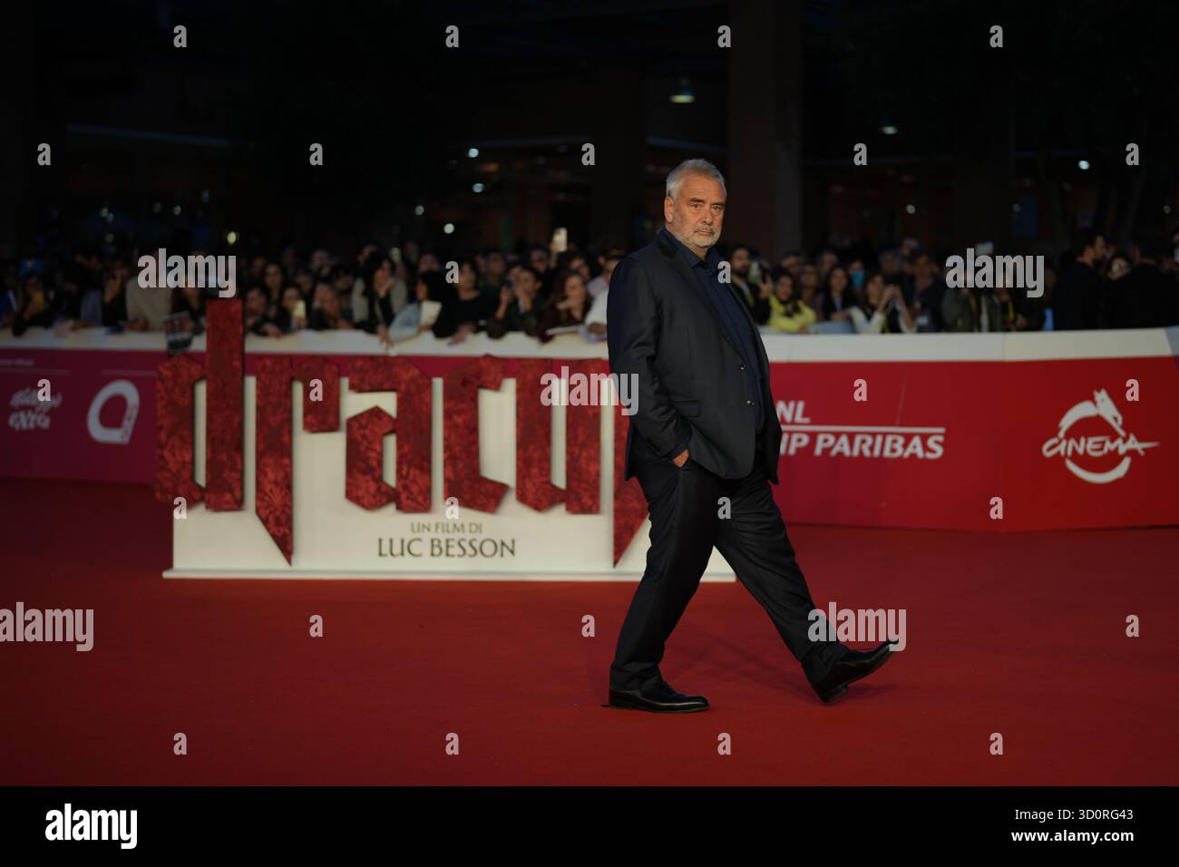 Luc Besson poses for photos on the red carpet for the screening of the ...