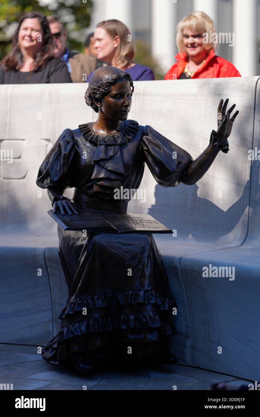 People view a newly unveiled statue of Helen Keller on the grounds of ...