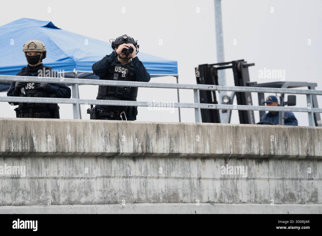United States Coast Guard personnel survey the scene during an ...