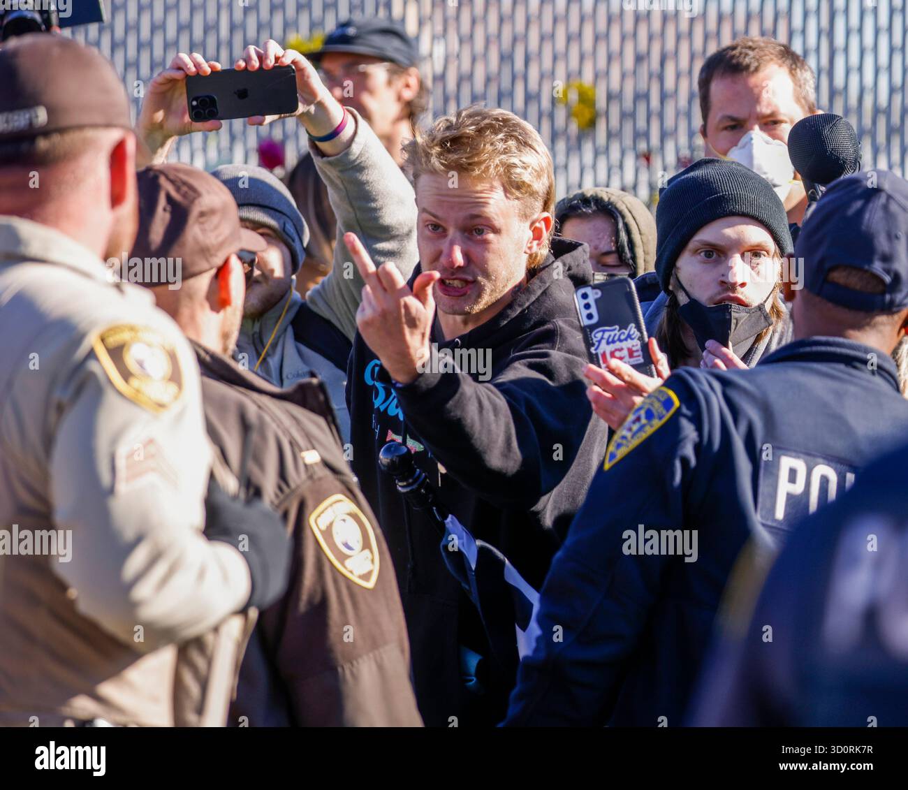 Chicago, United States. 24th Oct, 2025. An activist confronts Cook ...