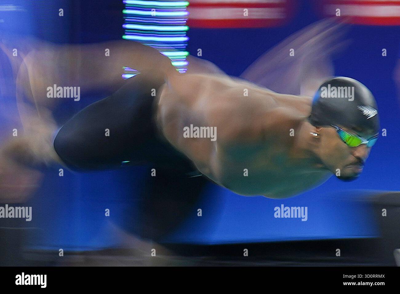 Canada's Josh Liendo dives off the blocks as he competes in a heat in ...