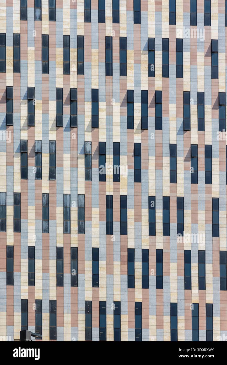 Abstract close-up of a modern building facade with vertical alternating ...