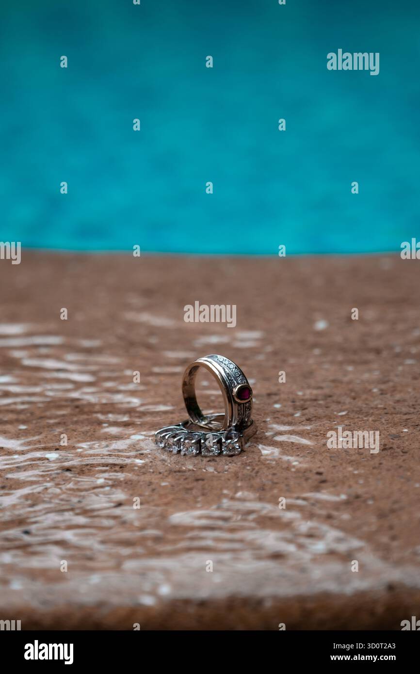 Diamond and Ruby rings in water pool concept Stock Photo - Alamy