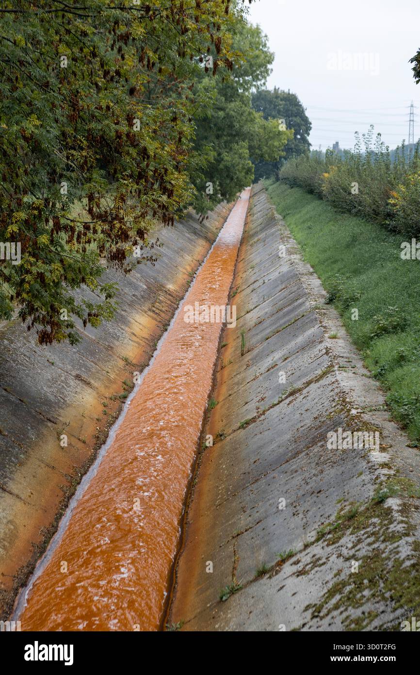 Brown-colored municipal waste drainage water in a concrete collector ...