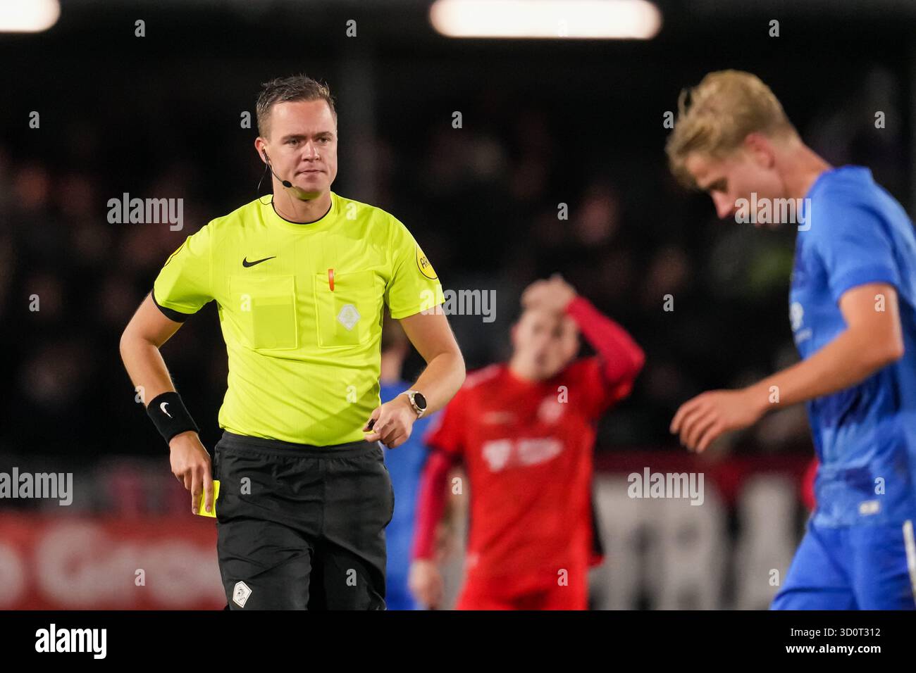 ALMERE, NETHERLANDS - OCTOBER 24: Referee Rick Sturm shows a yellow ...