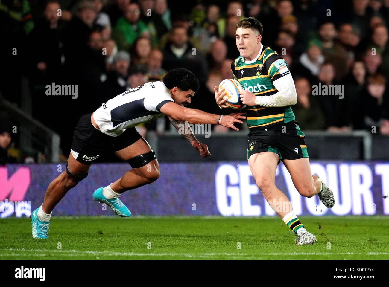 Northampton Saints' Tommy Freeman runs through to score their eighth ...