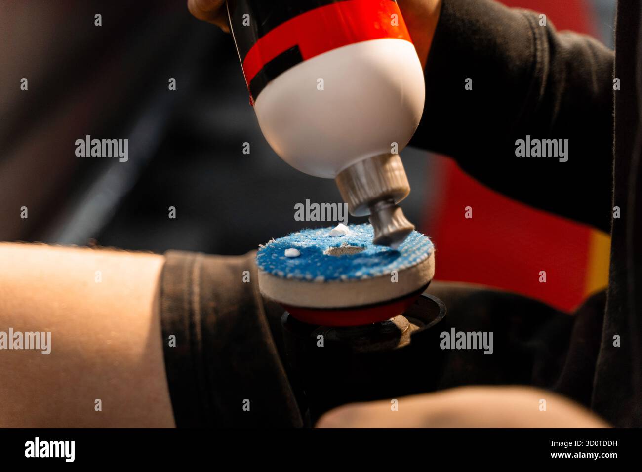 Applying polishing compound close-up. Detailer applies polishing ...