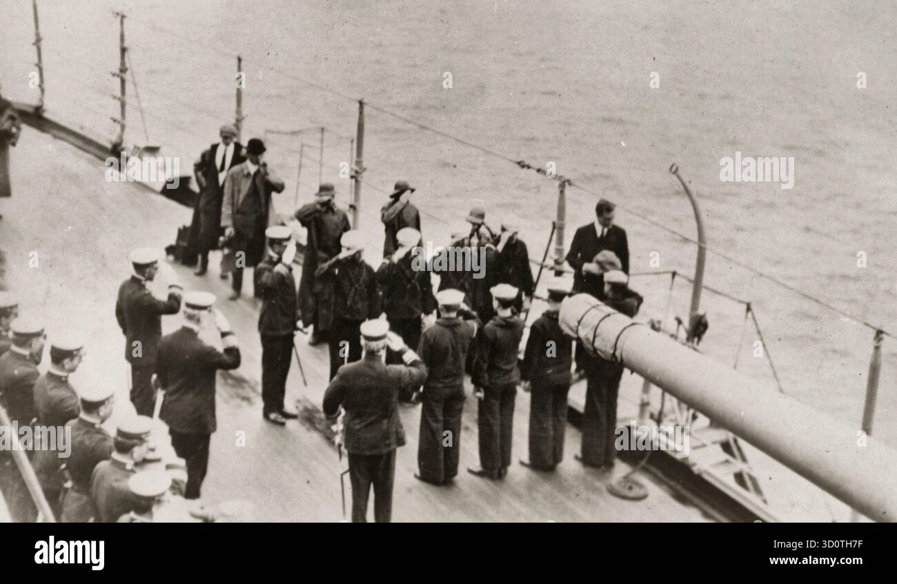 Officers of the USS Arkansas salute as Assistant Secretary of the Navy ...