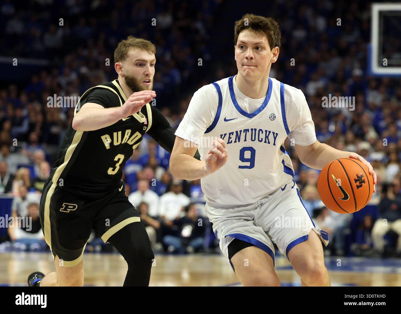 Kentucky's Trent Noah (9) drives while guarded by Purdue's Braden Smith ...