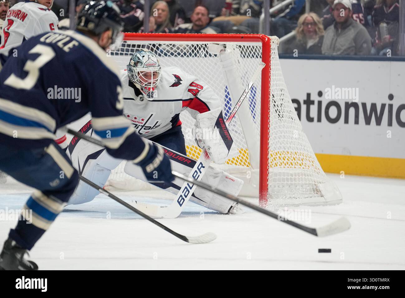 Columbus Blue Jackets center Charlie Coyle (3) skates in for a rebound ...