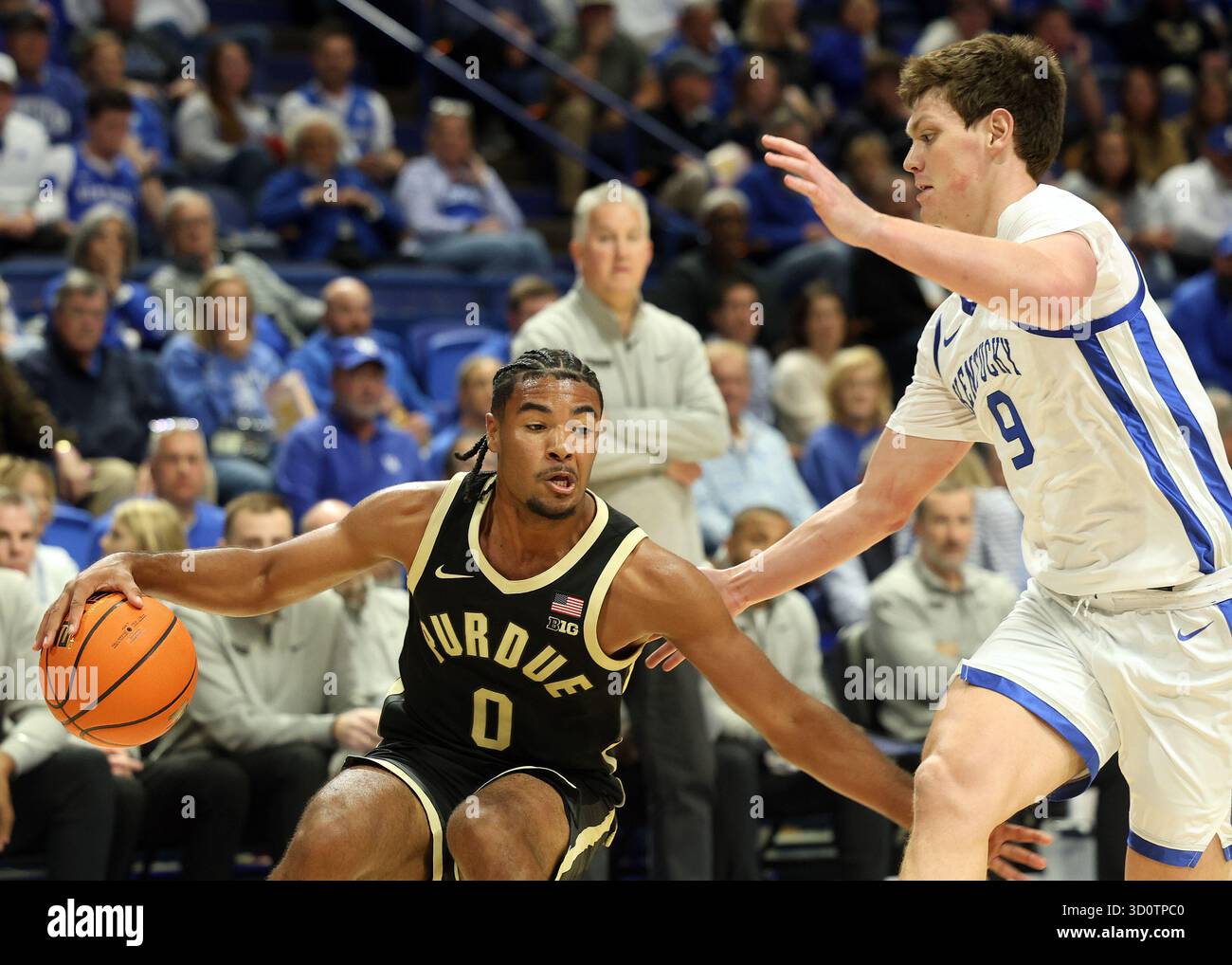 Purdue's C.J. Cox (0) looks for an opening against Kentucky's Trent ...