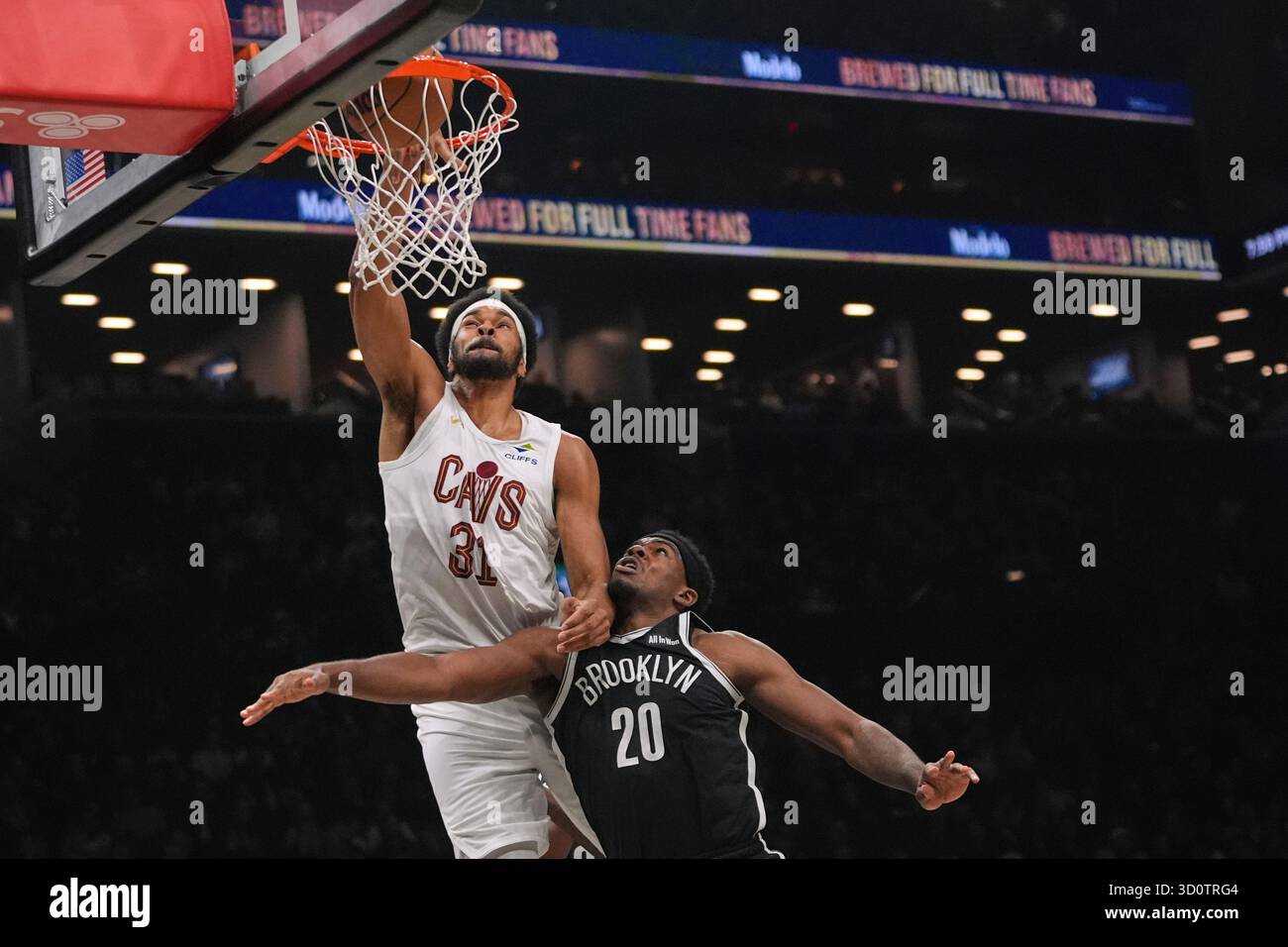 Cleveland Cavaliers' Jarrett Allen (31) dunks the ball in front of ...