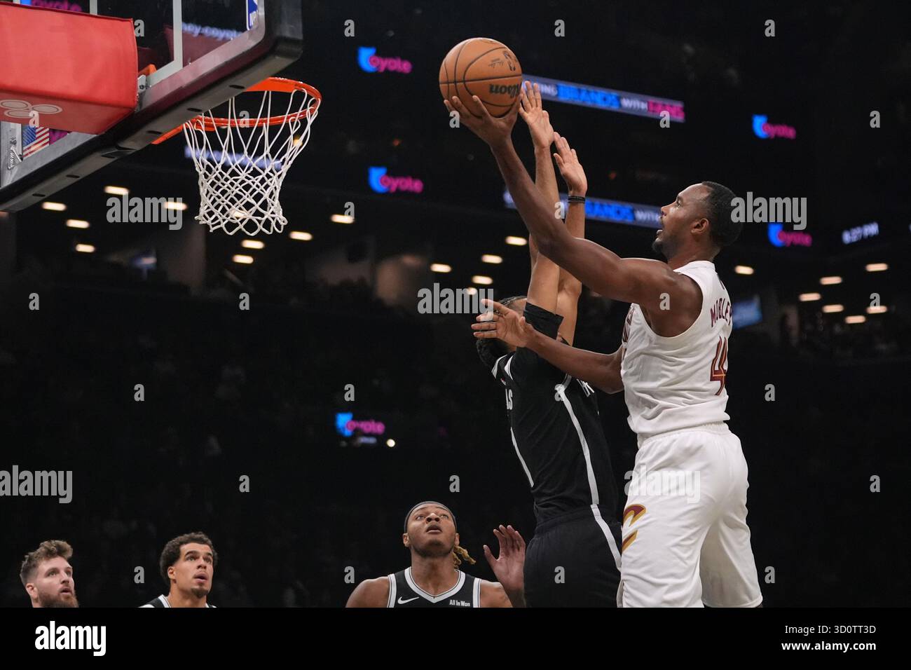 Cleveland Cavaliers' Evan Mobley (4) shoots over Brooklyn Nets' Ziaire ...