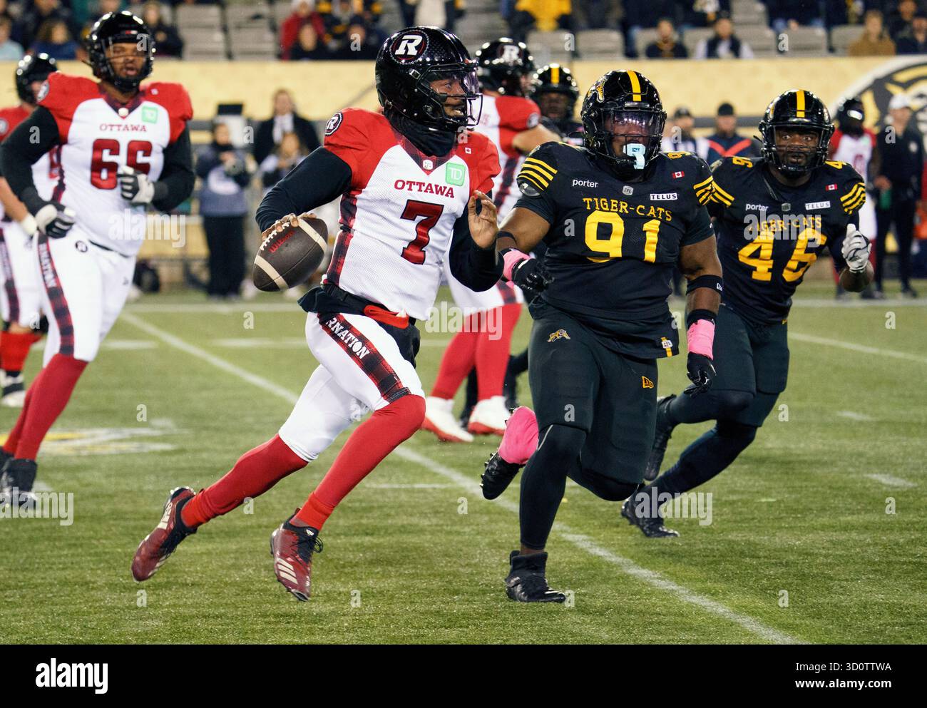 Ottawa Redblacks quarterback Tyrie Adams (7) scrambles during the first ...