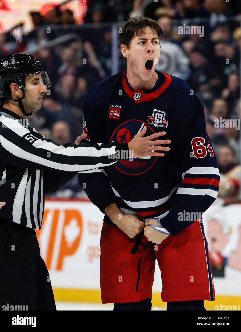 Winnipeg Jets' Logan Stanley (64) reacts after a fight against Calgary ...