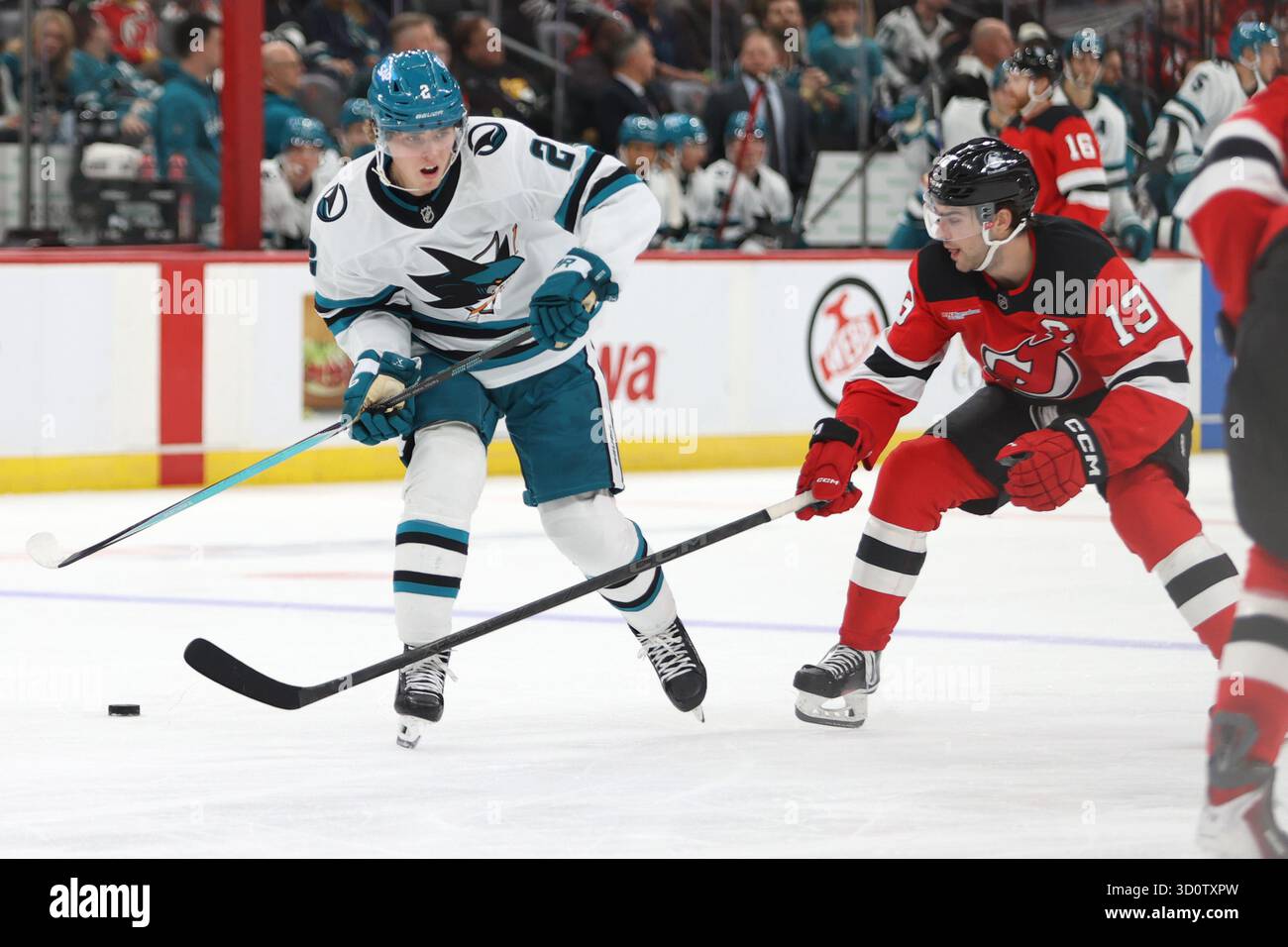 San Jose Sharks' Will Smith, left, and New Jersey Devils' Nico Hischier ...