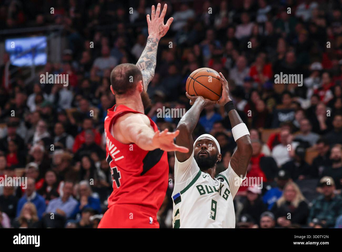 Milwaukee Bucks' Bobby Portis (9) shoots over Toronto Raptors' Sandro ...