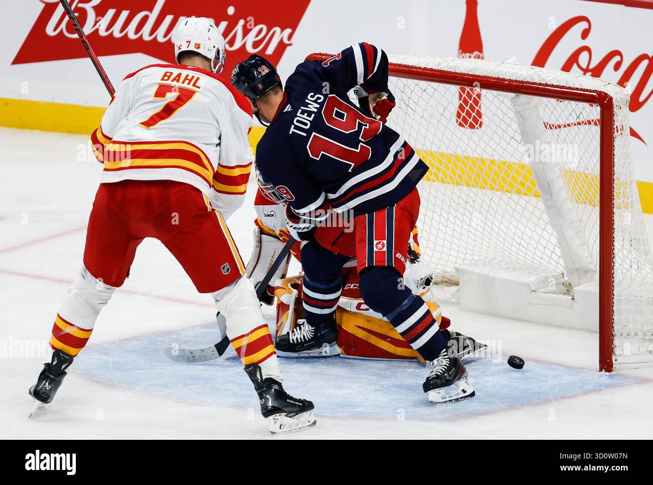 Winnipeg Jets' Jonathan Toews (19) scores against Calgary Flames ...