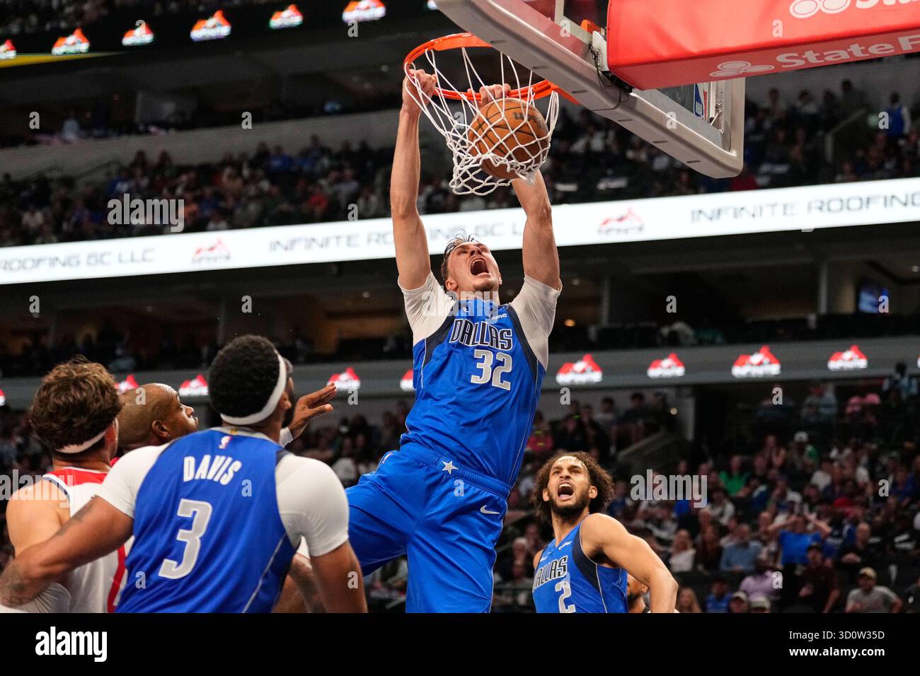 Dallas Mavericks forward Cooper Flagg (32) dunks as Anthony Davis (3 ...