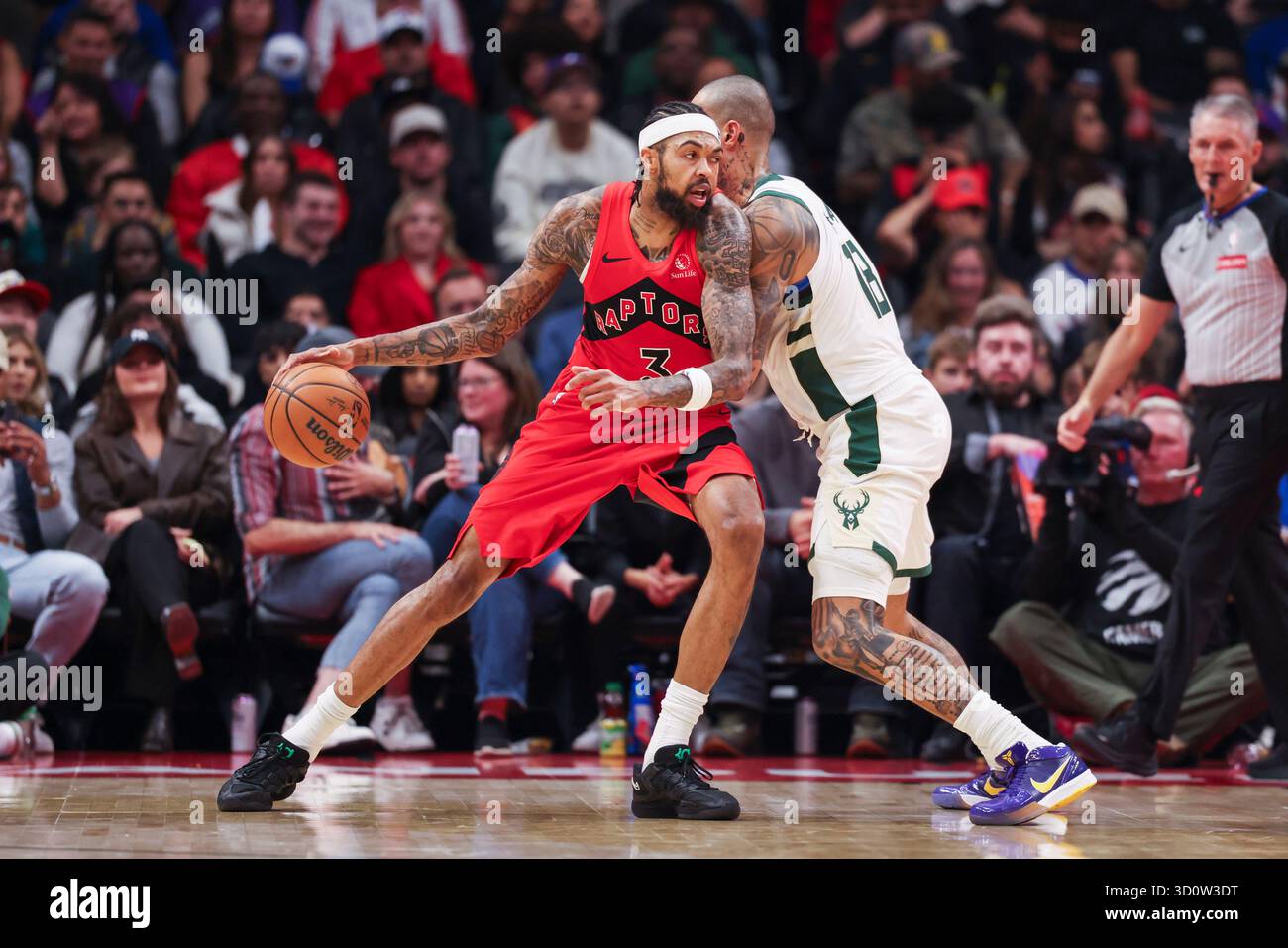 Toronto Raptors' Brandon Ingram (3) tries to move past Milwaukee Bucks ...