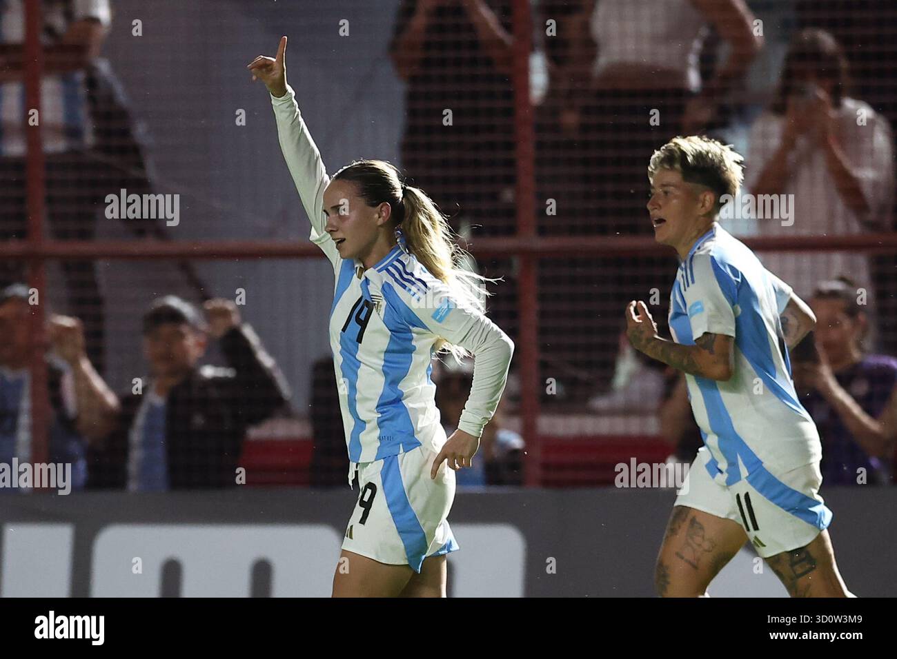 Argentina's midfielder Agostina Holzheier (L) celebrates after scoring ...