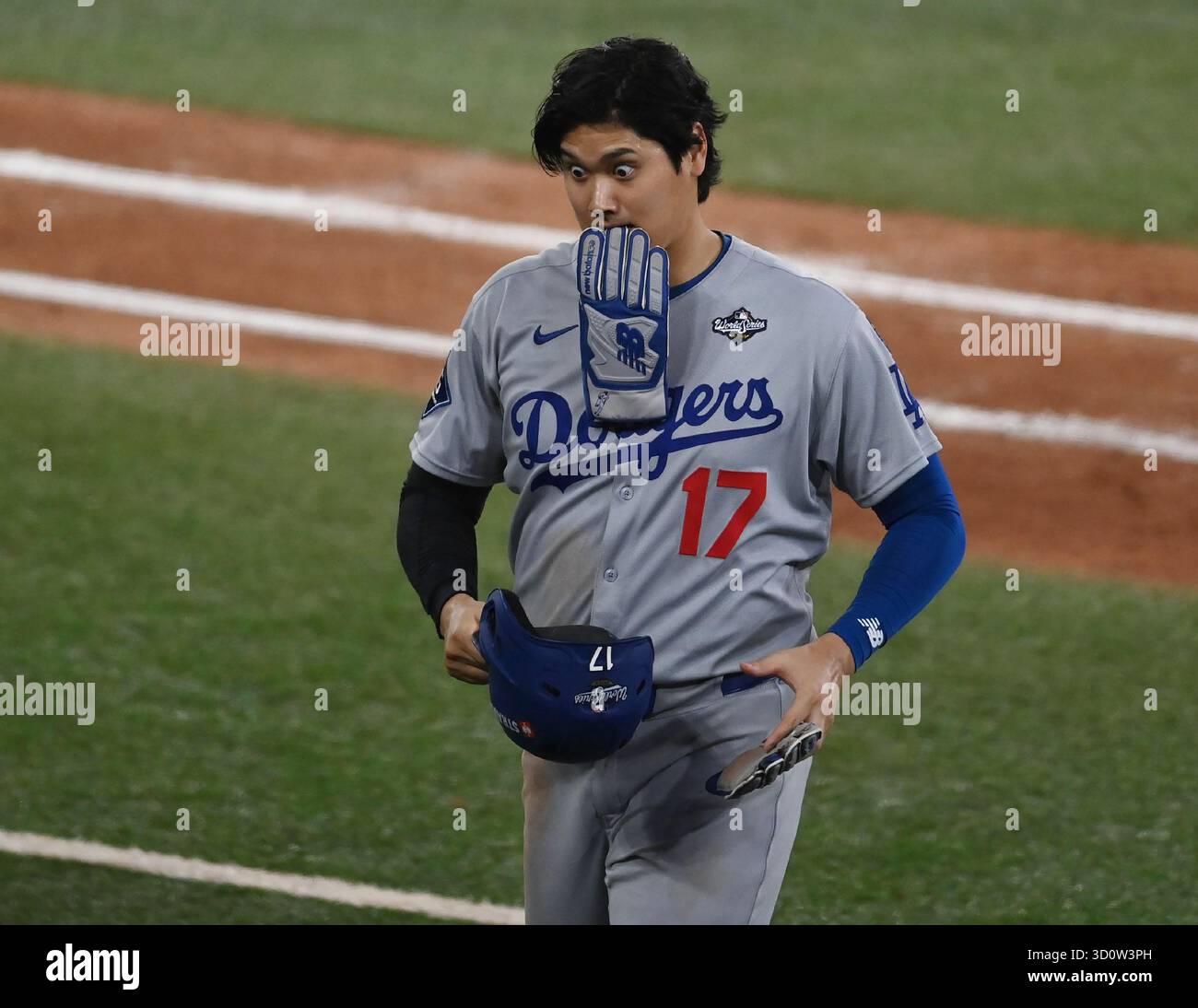 Los Angeles Dodgers designated hitter Shohei Ohtani reacts after losing ...