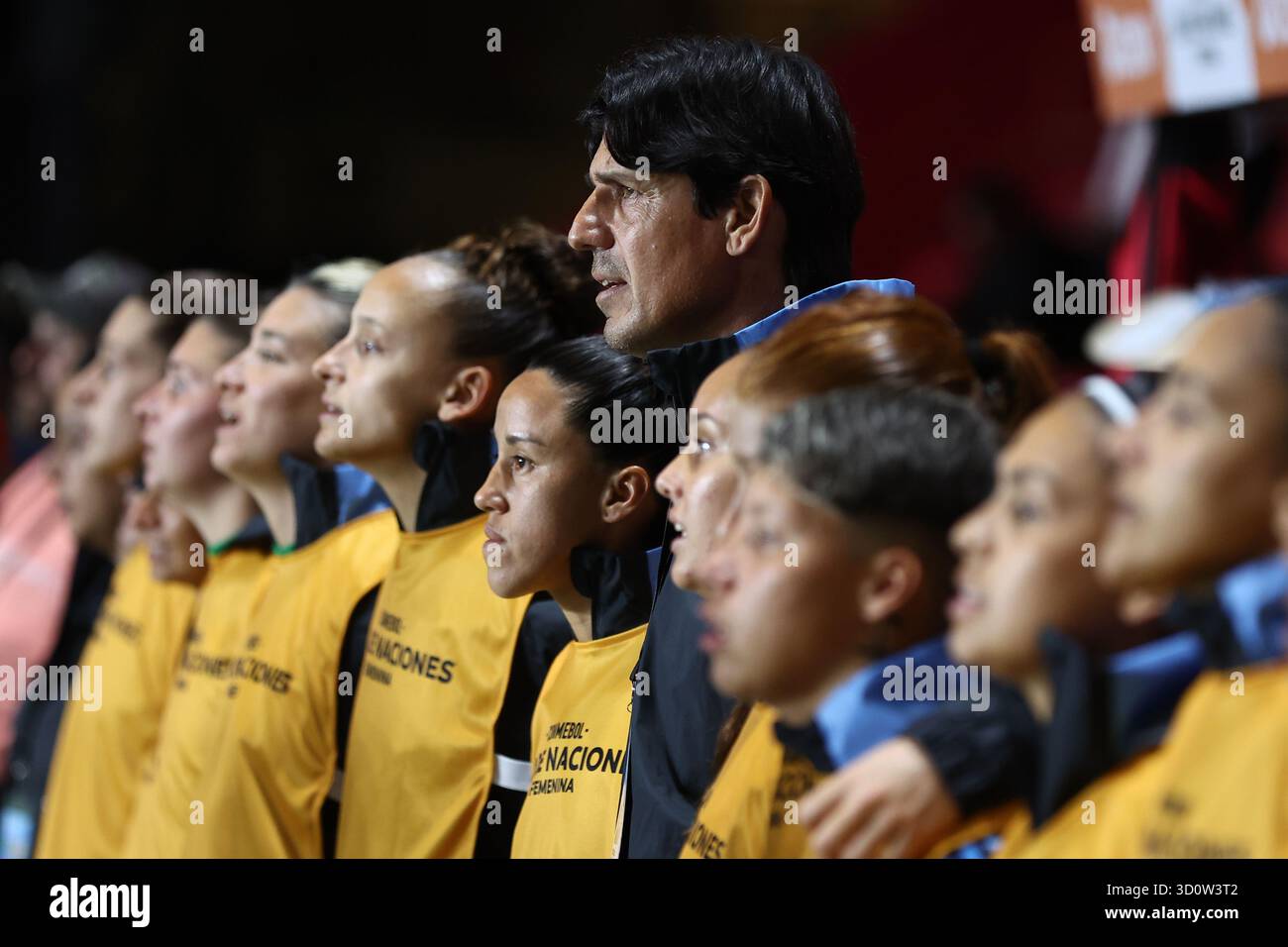 Argentina's head coach German Portanova (C) and players sing the ...