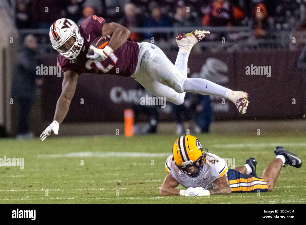 Virginia Tech running back Marcellous Hawkins (27) goes over California ...