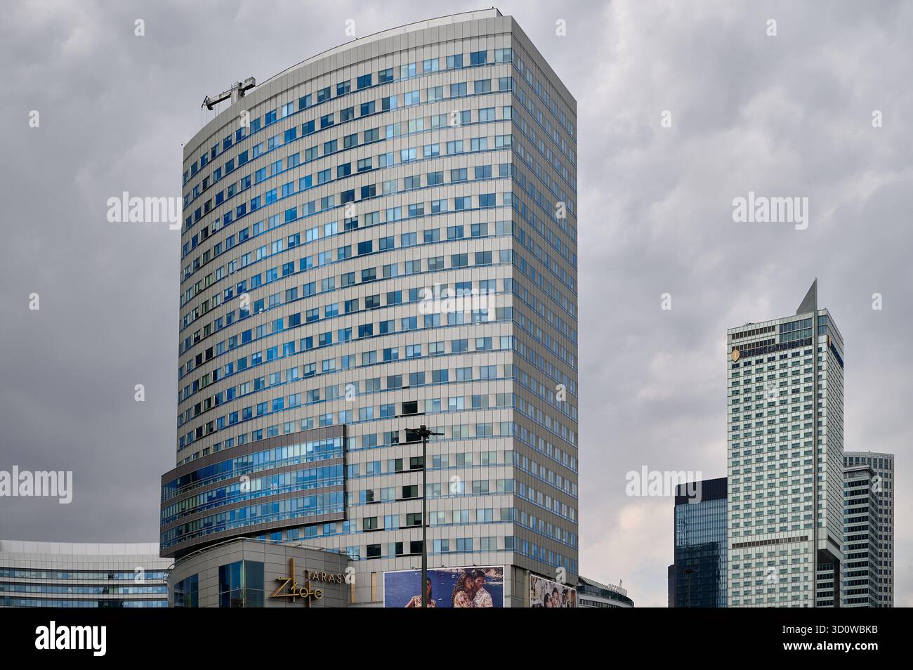 Cylindrical modern office tower with curved rounded corner glass and ...