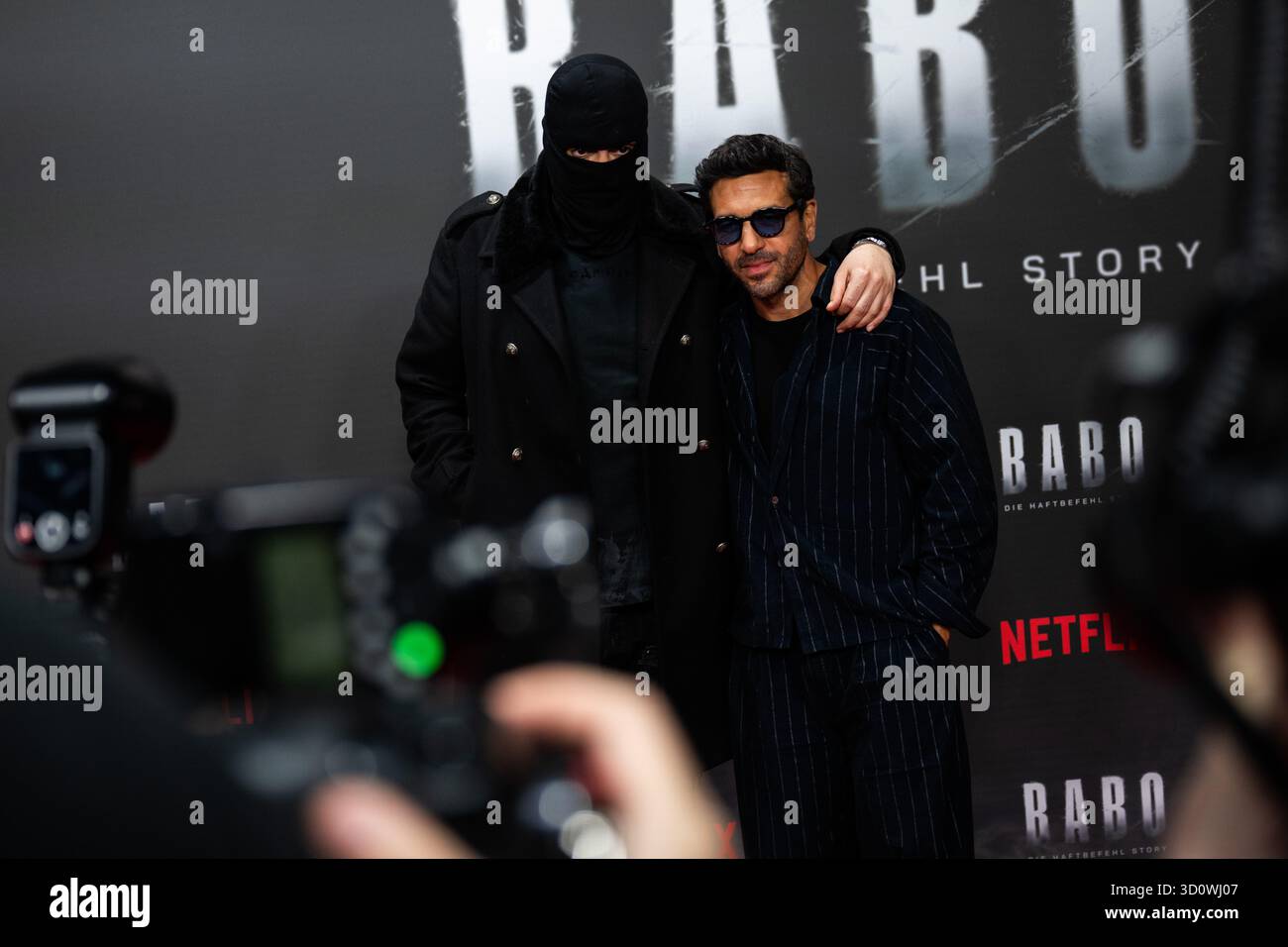 24 October 2025, Berlin: Haftbefehl (l, real name Aykut Anhan) and ...