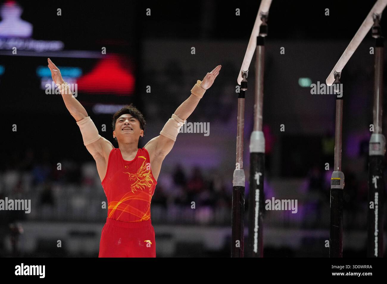 Zou Jingyuan of China competes in the men's parallel bars final during ...
