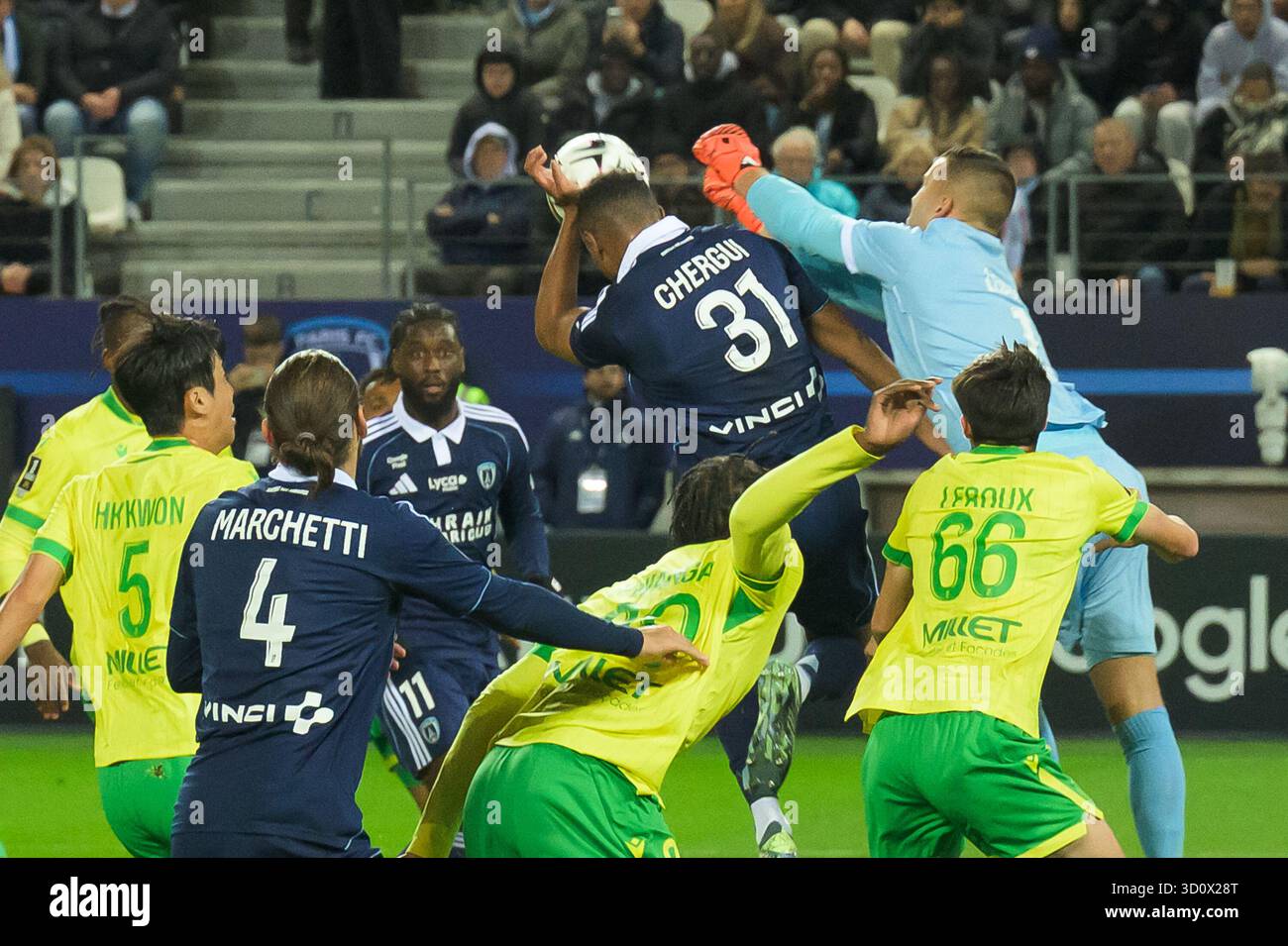 Samir Sophian Chergui of Paris FC and Anthony Lopes of FC Nantes during ...