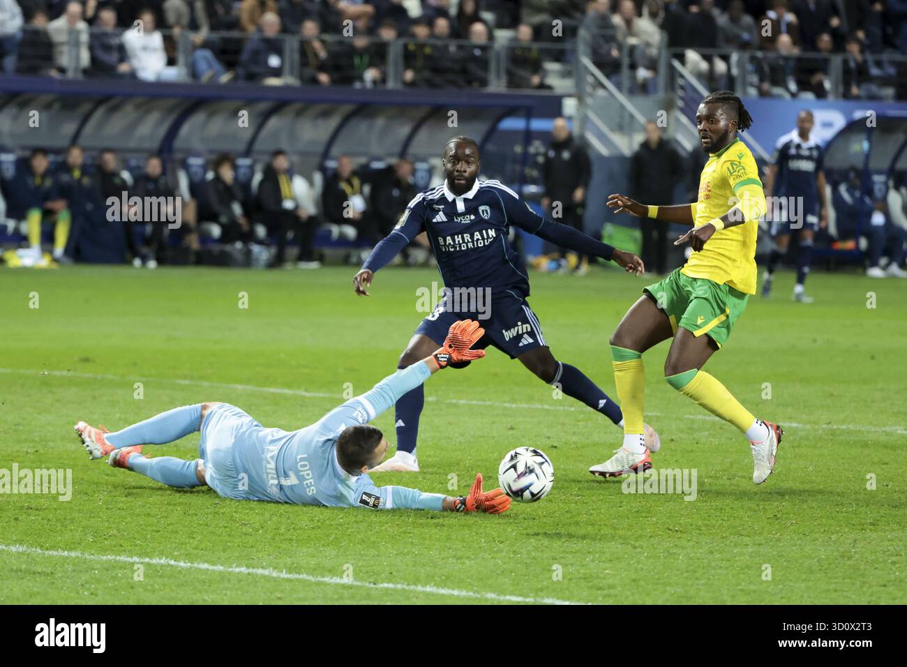 Jonathan Ikone of Paris FC, Chidozie Awaziem of Nantes, left Nantes ...