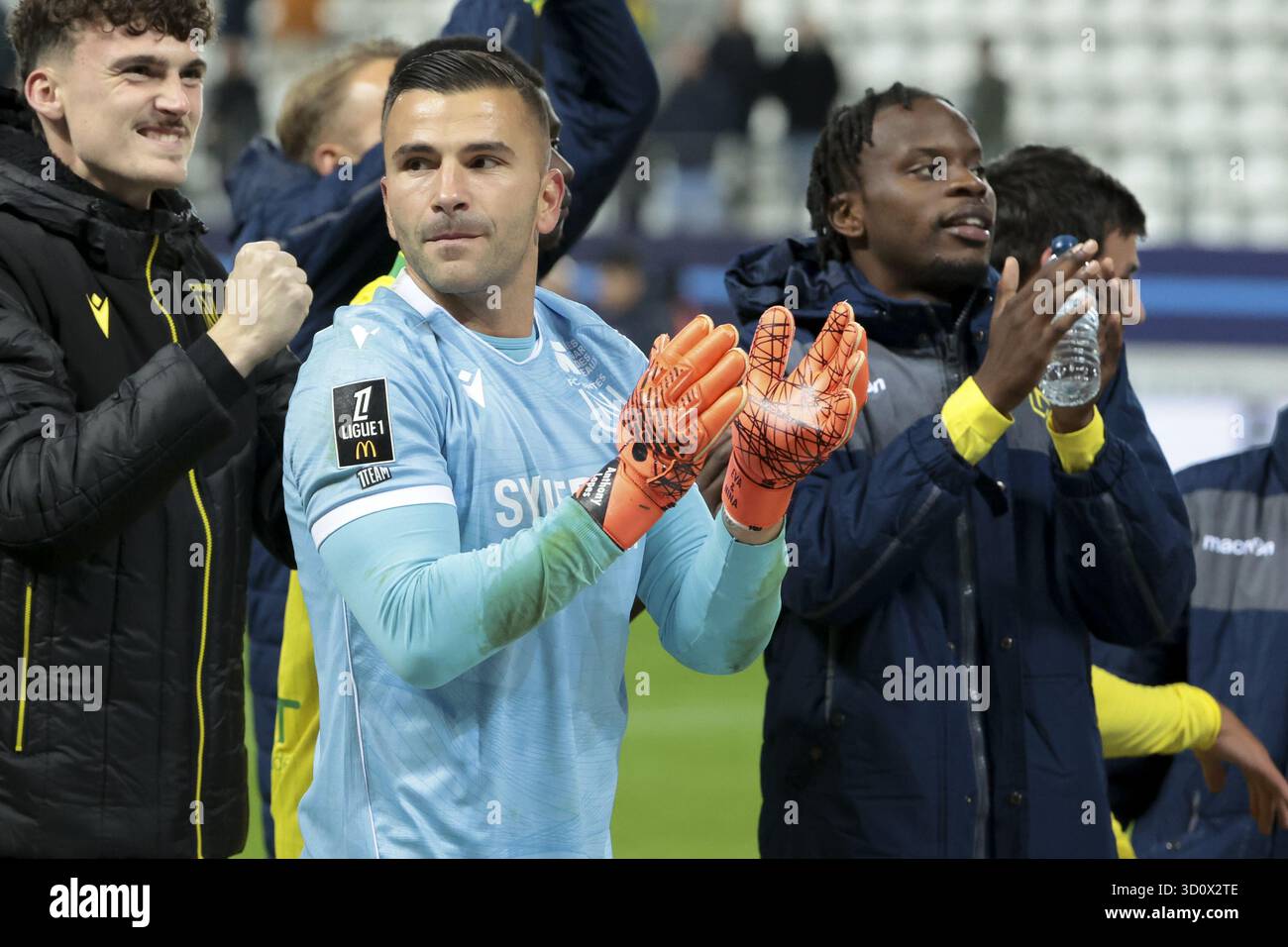 Nantes goalkeeper Anthony Lopes, Junior Mwanga of Nantes celebrate the ...