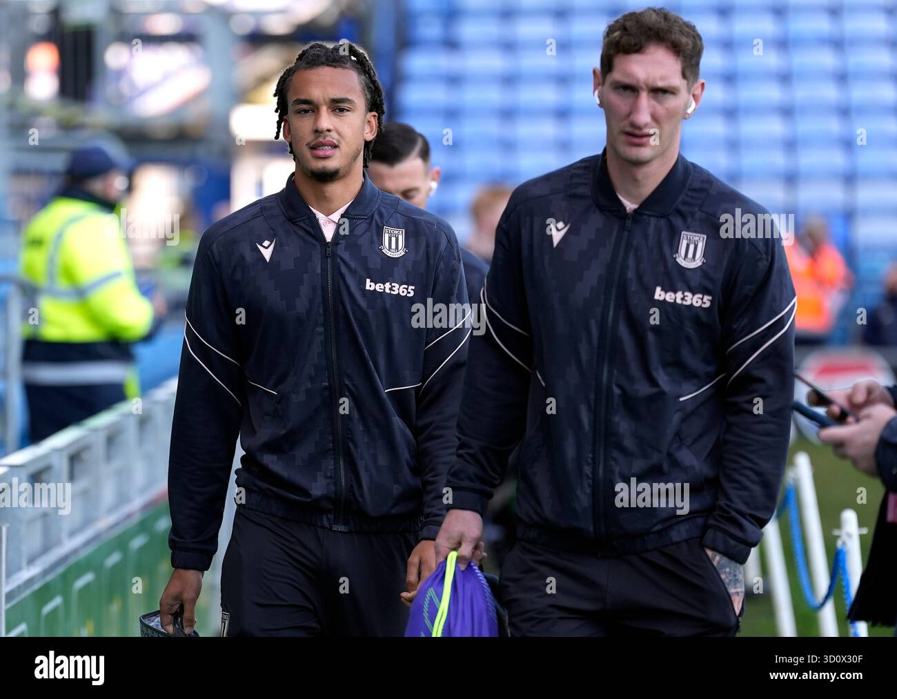 Stoke City's Ashley Phillips (left) and goalkeeper Jack Bonham arrive ...