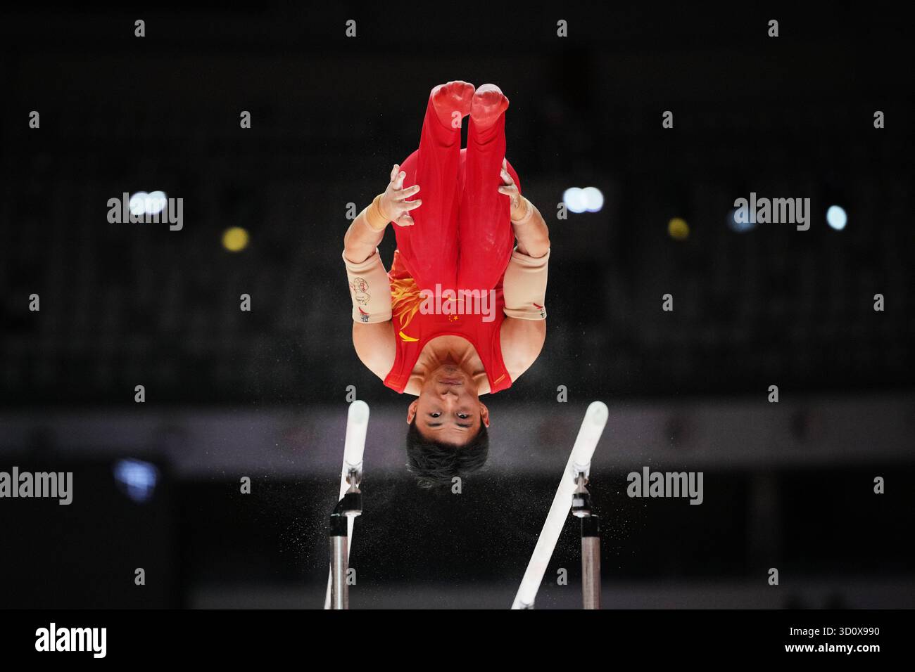 Shi Chong of China competes in the men's parallel bars final during the ...
