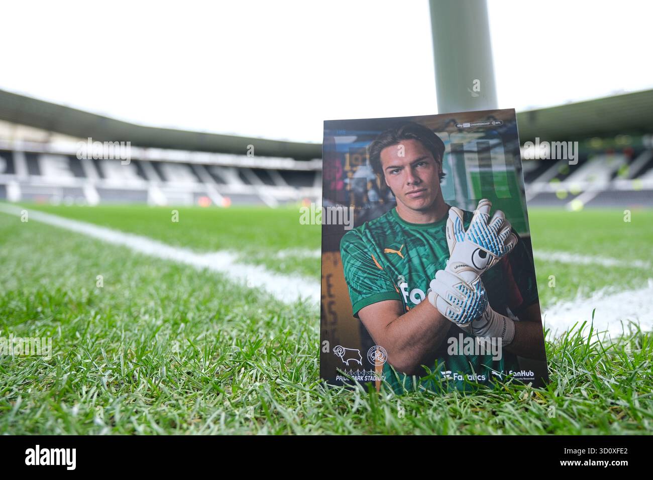 Matchday programme leaning against the corner flag prior to kick off ...