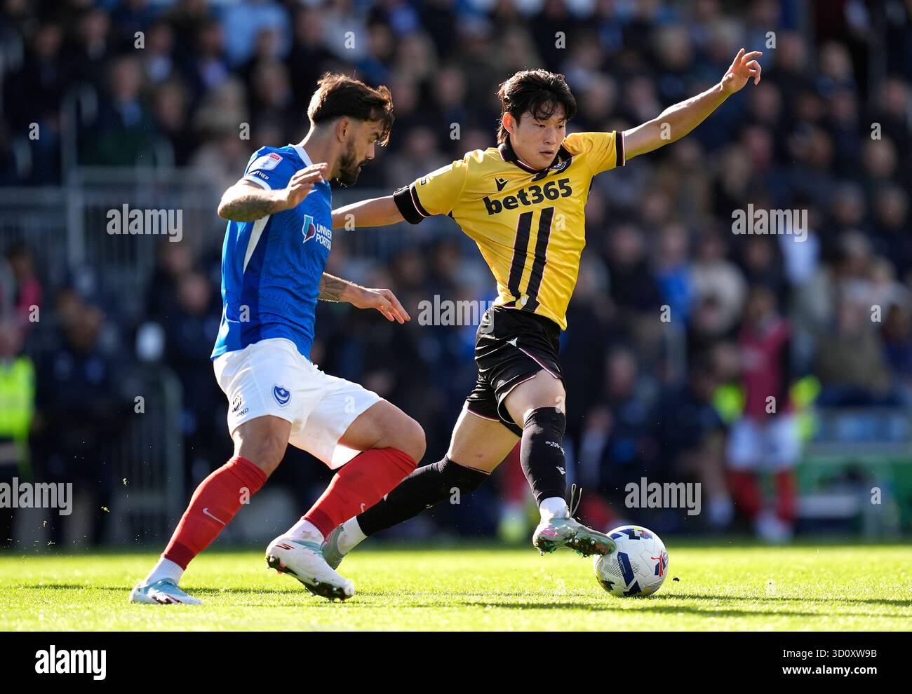 Portsmouth's Marlon Pack (left) and Stoke City's Bae Jun-Ho battle for ...