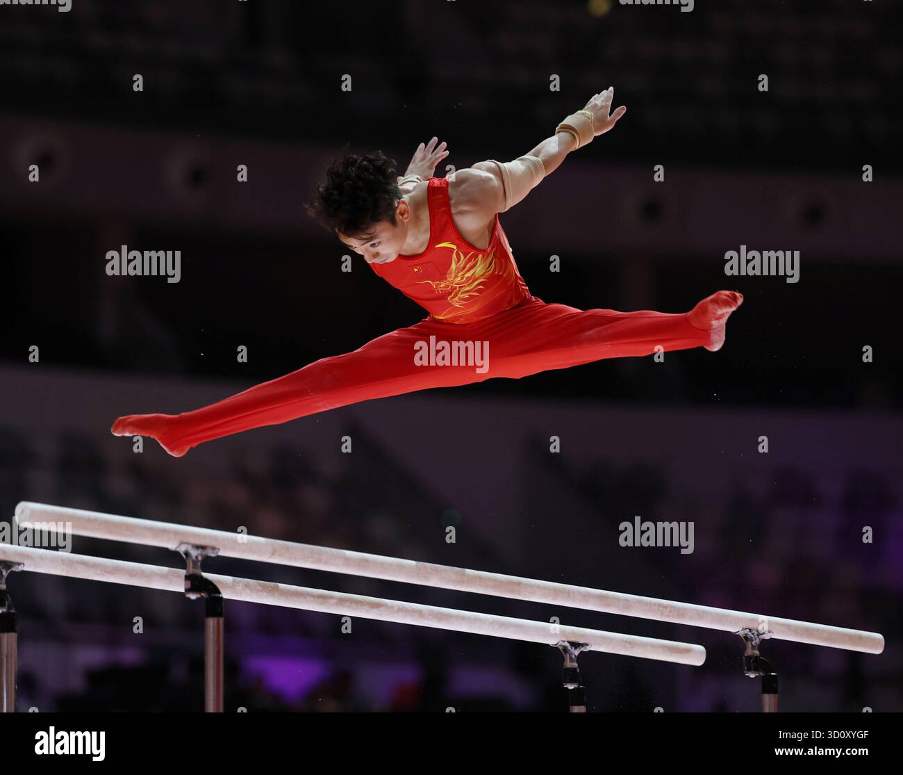 Jingyuan ZOU of China performs during men's parallel bars final of the ...