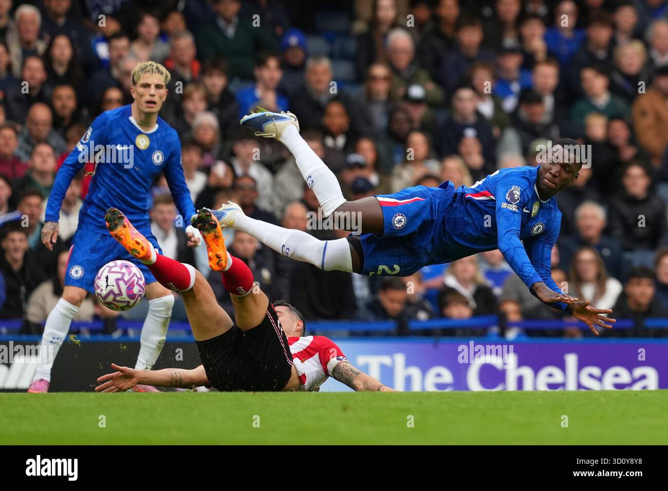 Chelsea's Moises Caicedo, right, falls over Sunderland's Granit Xhaka ...