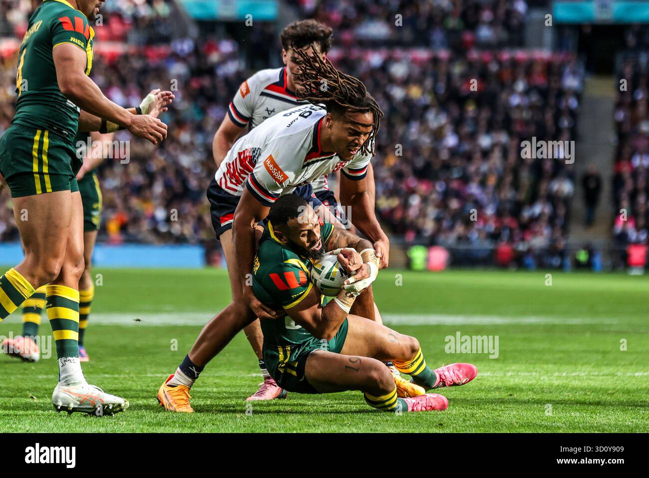 Josh Addo-Carr of Australia is tackled by Dom Young of England of ...