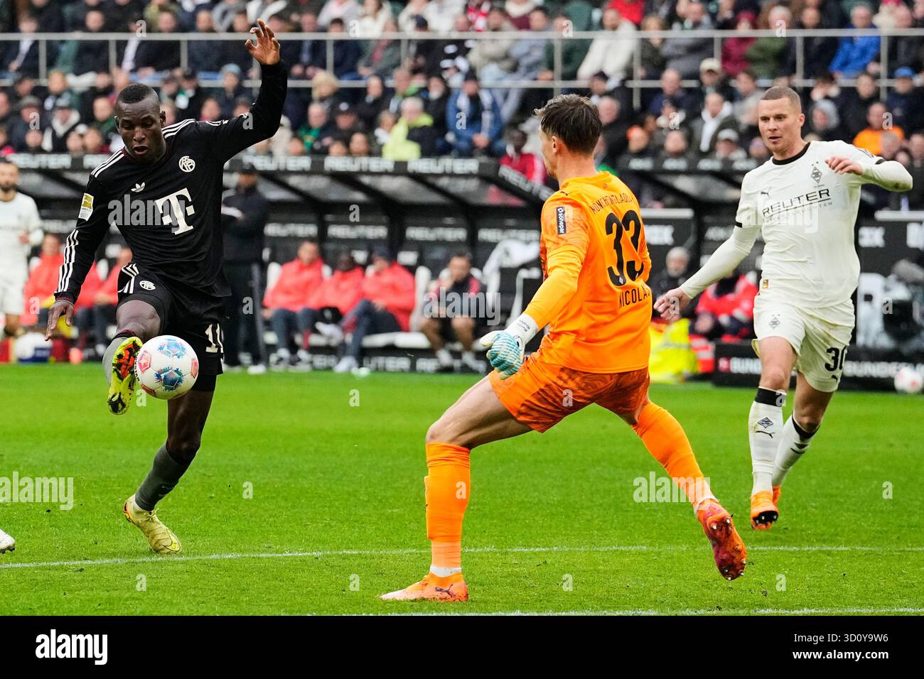 Bayern's Nicolas Jackson, left, fails to score during the German ...