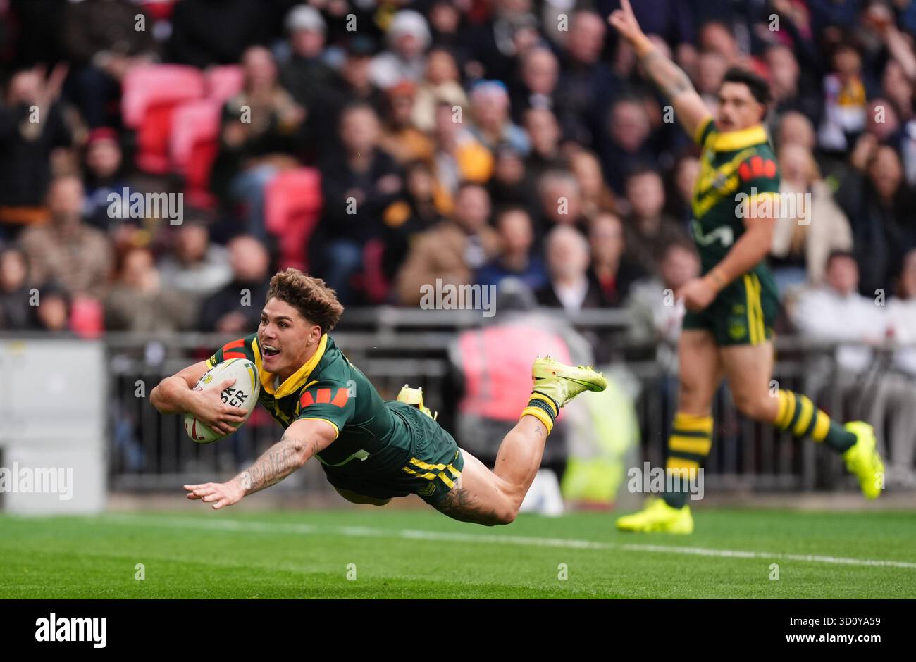 Australia's Reece Walsh scores a try during the ABK Beer Ashes Series ...