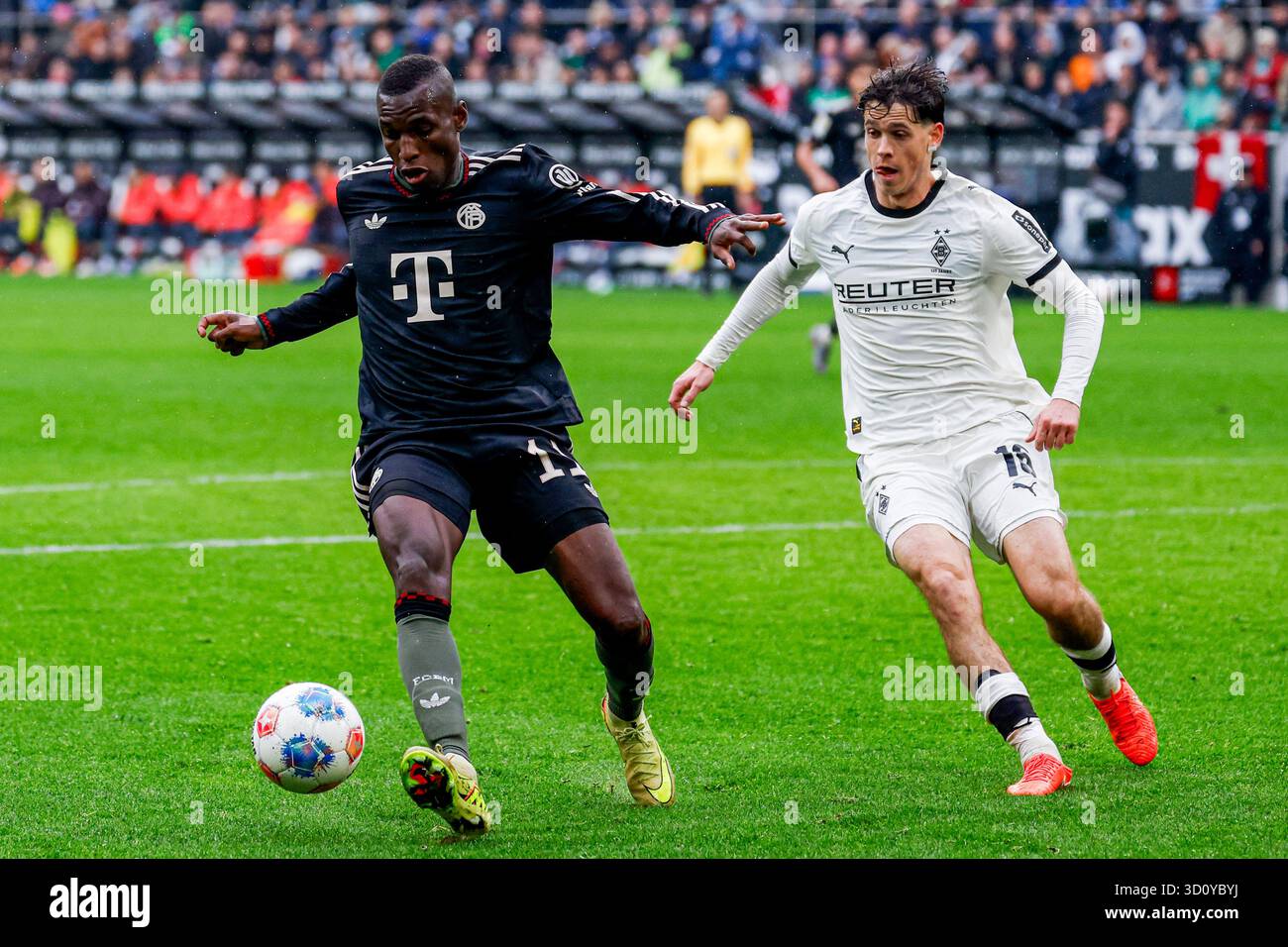 Nicolas Jackson of FC Bayern München dribbles with the ball under ...